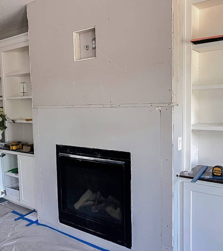 DIY Black Roman Clay Fireplace | Crystel Montenegro Home